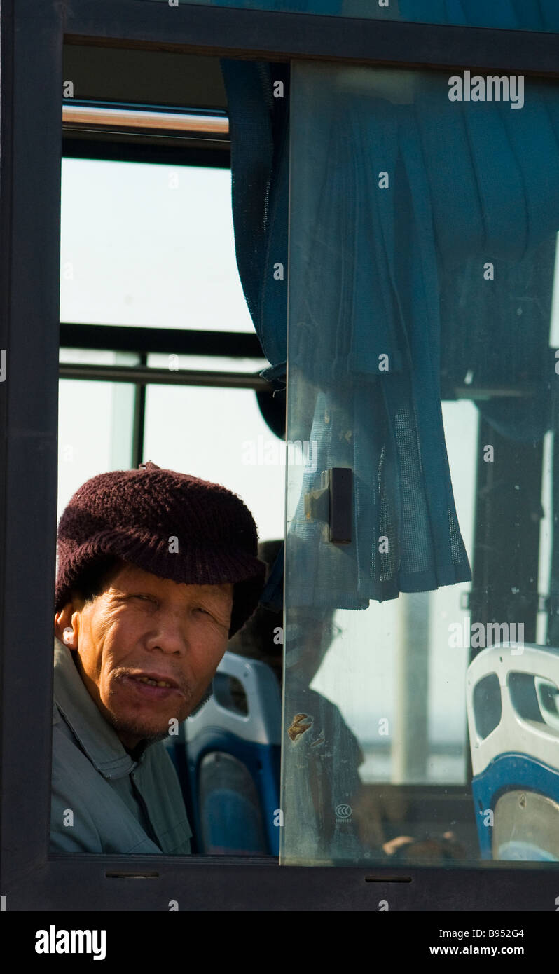 Checking out the photographer through the bus's window Stock Photo - Alamy