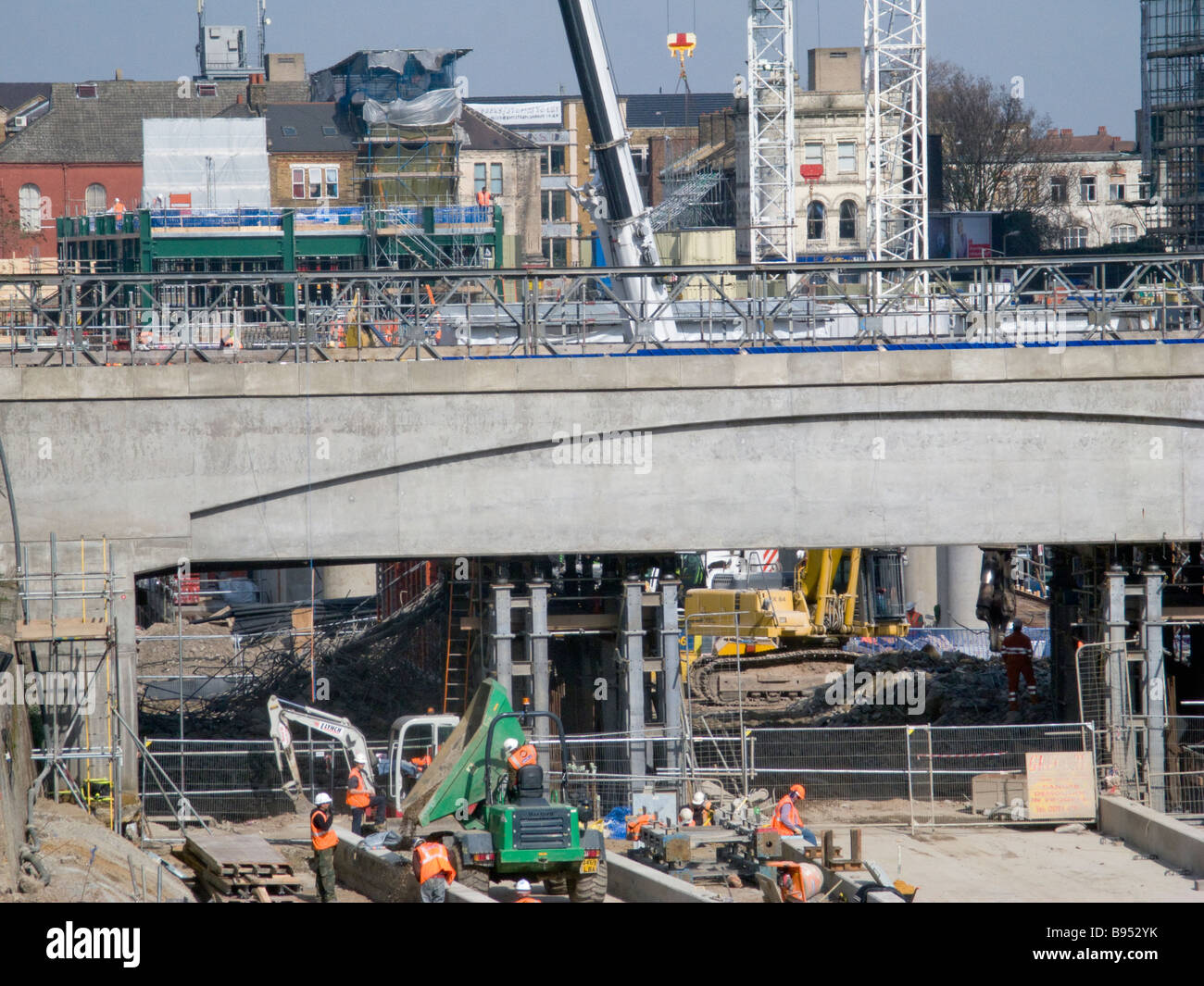 UK. Workers at bridge for new East London Line Tube station for Olympic ...
