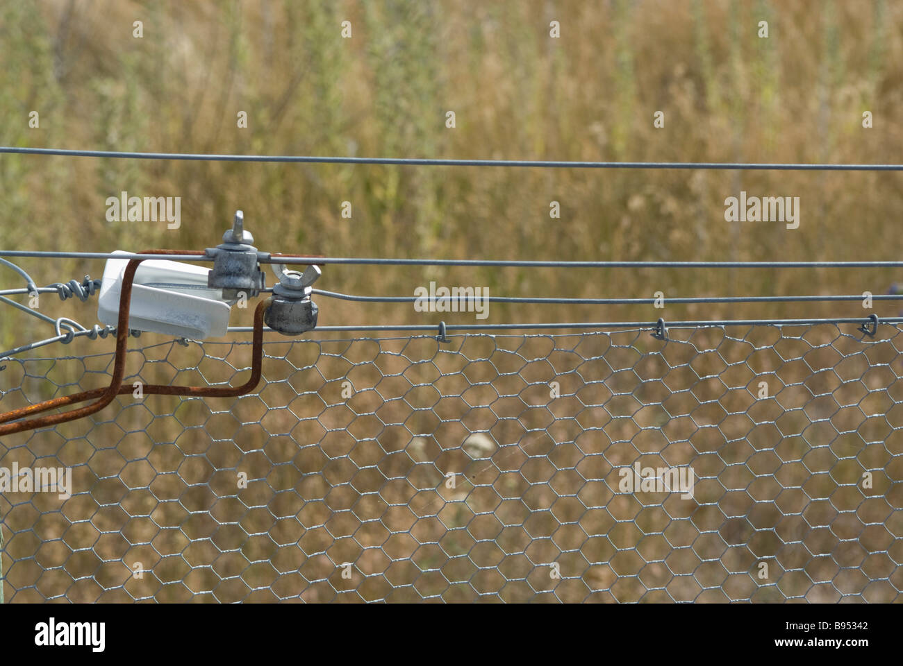 Electric fittings on the predator proof fence protecting the Department ...