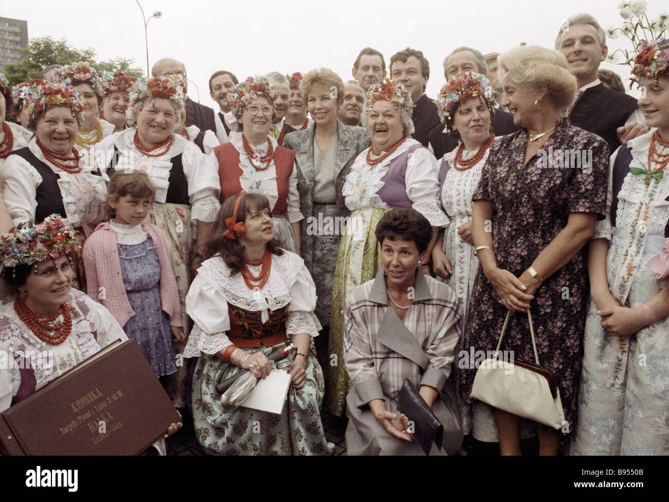 Raisa Gorbacheva center with folk costumed Katowice people during ...