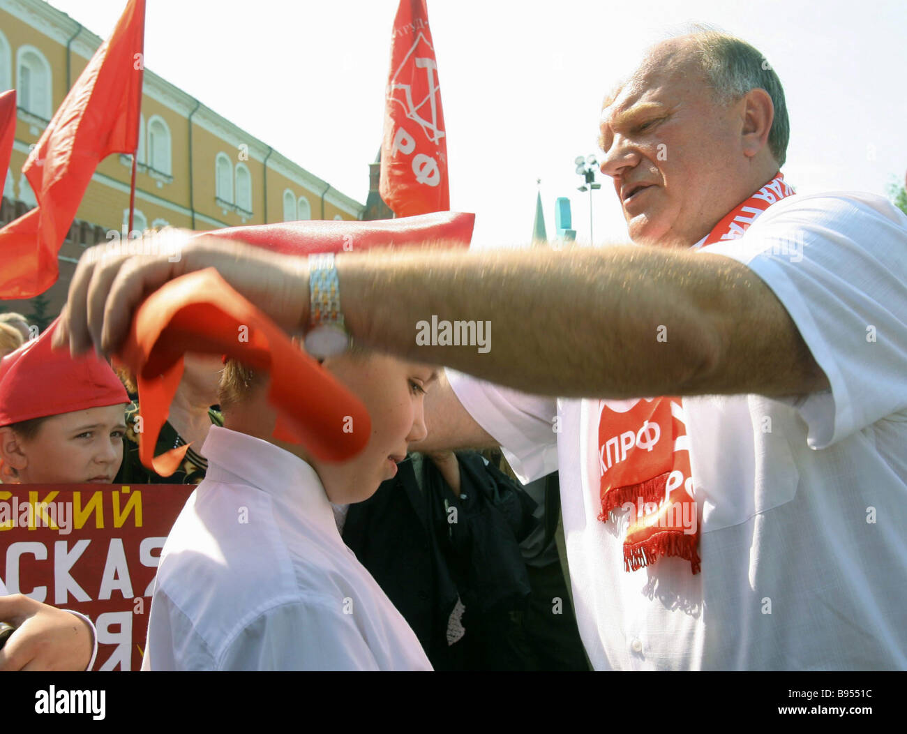 Communist Party leader Gennady Zyuganov tying a pioneer tie A solemn ...