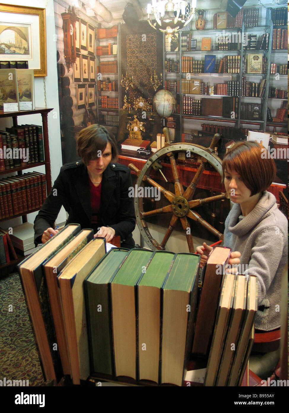At an antique book fair Stock Photo - Alamy