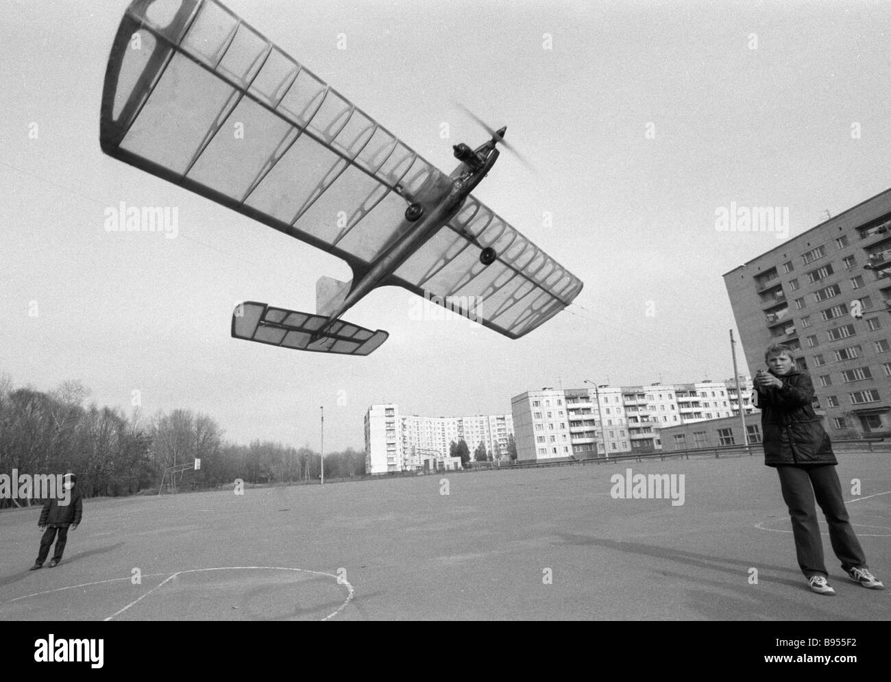 Boy flying his aircraft model Stock Photo - Alamy
