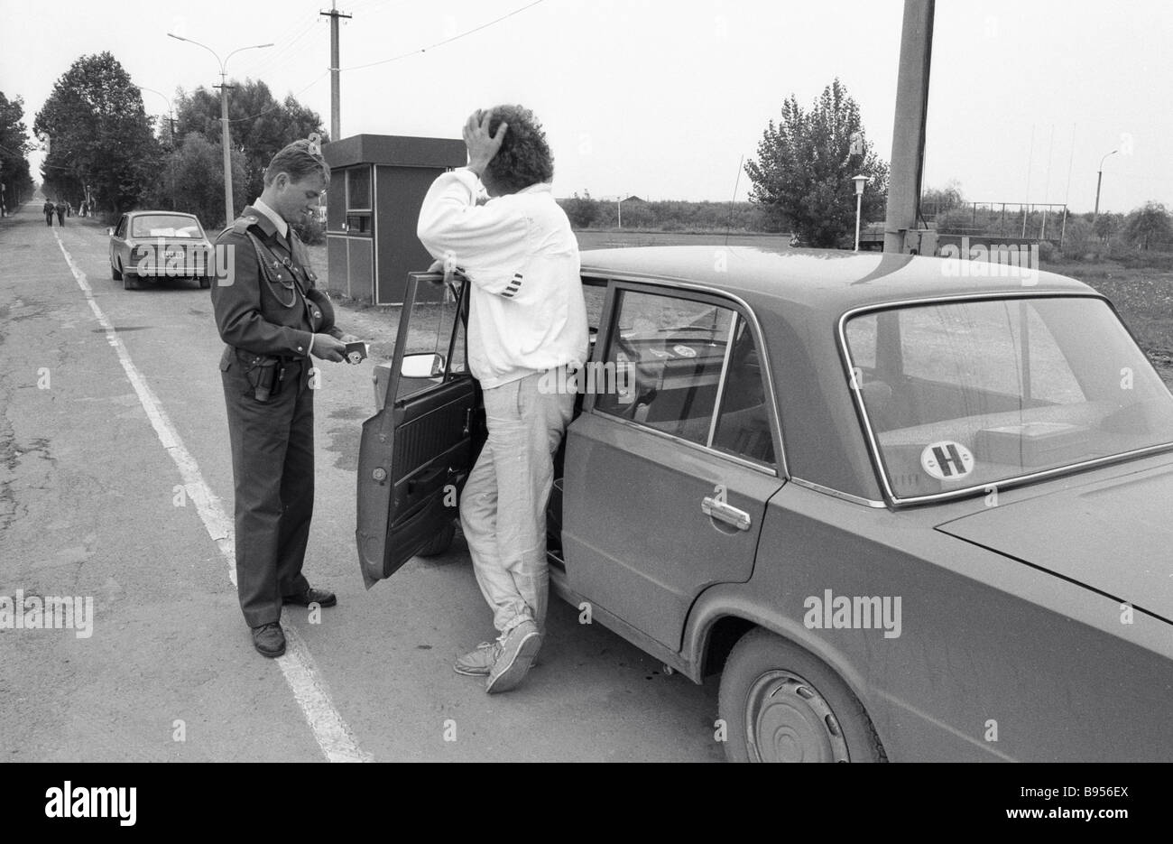 A customs officer checking documents at easy crossing checkpoint Stock ...