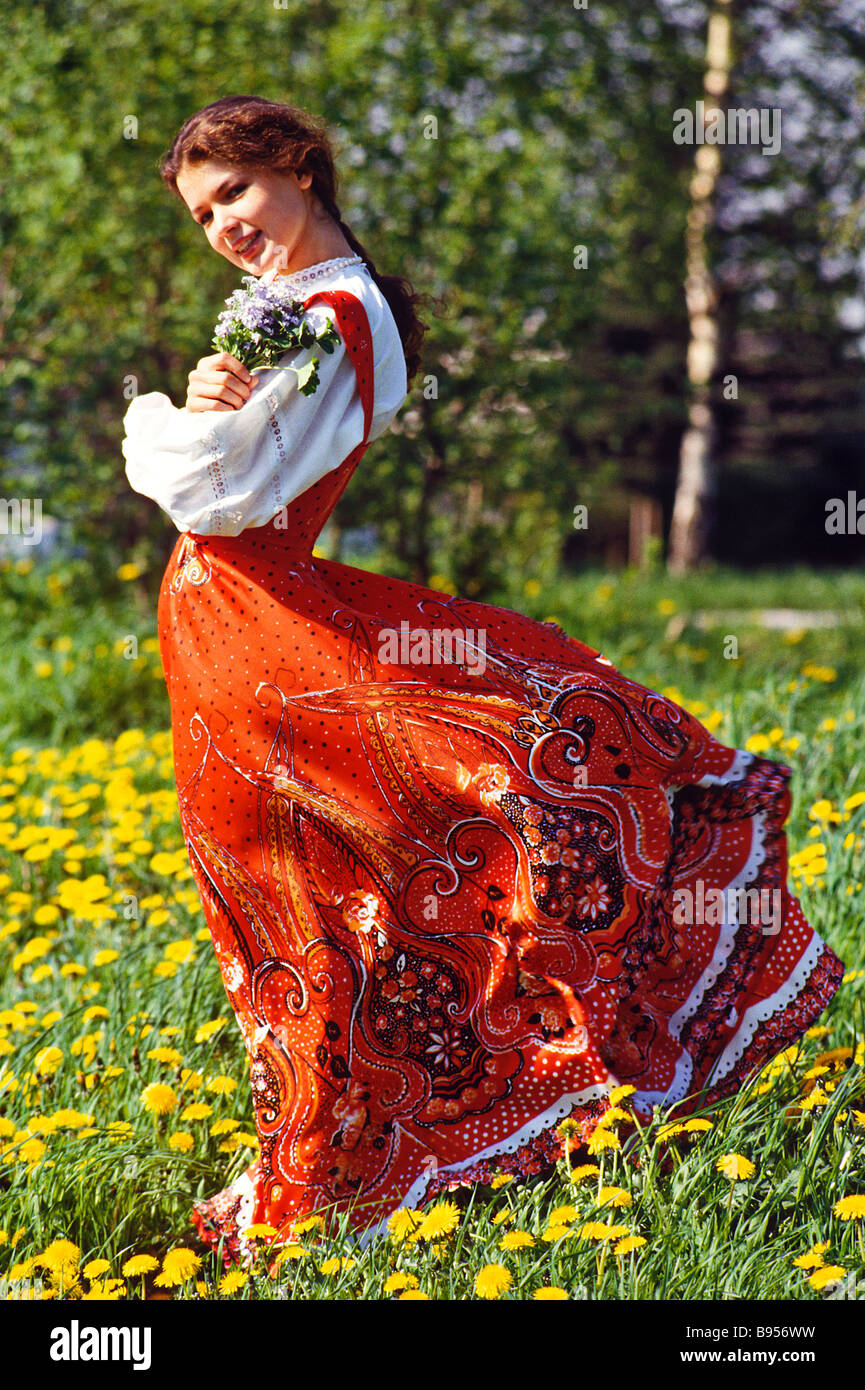 Girl wearing Russian sarafan dress in forest near Moscow Stock Photo ...