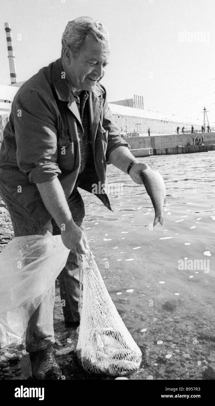 Fishing near a nuclear power plant s dive culvert Stock Photo - Alamy