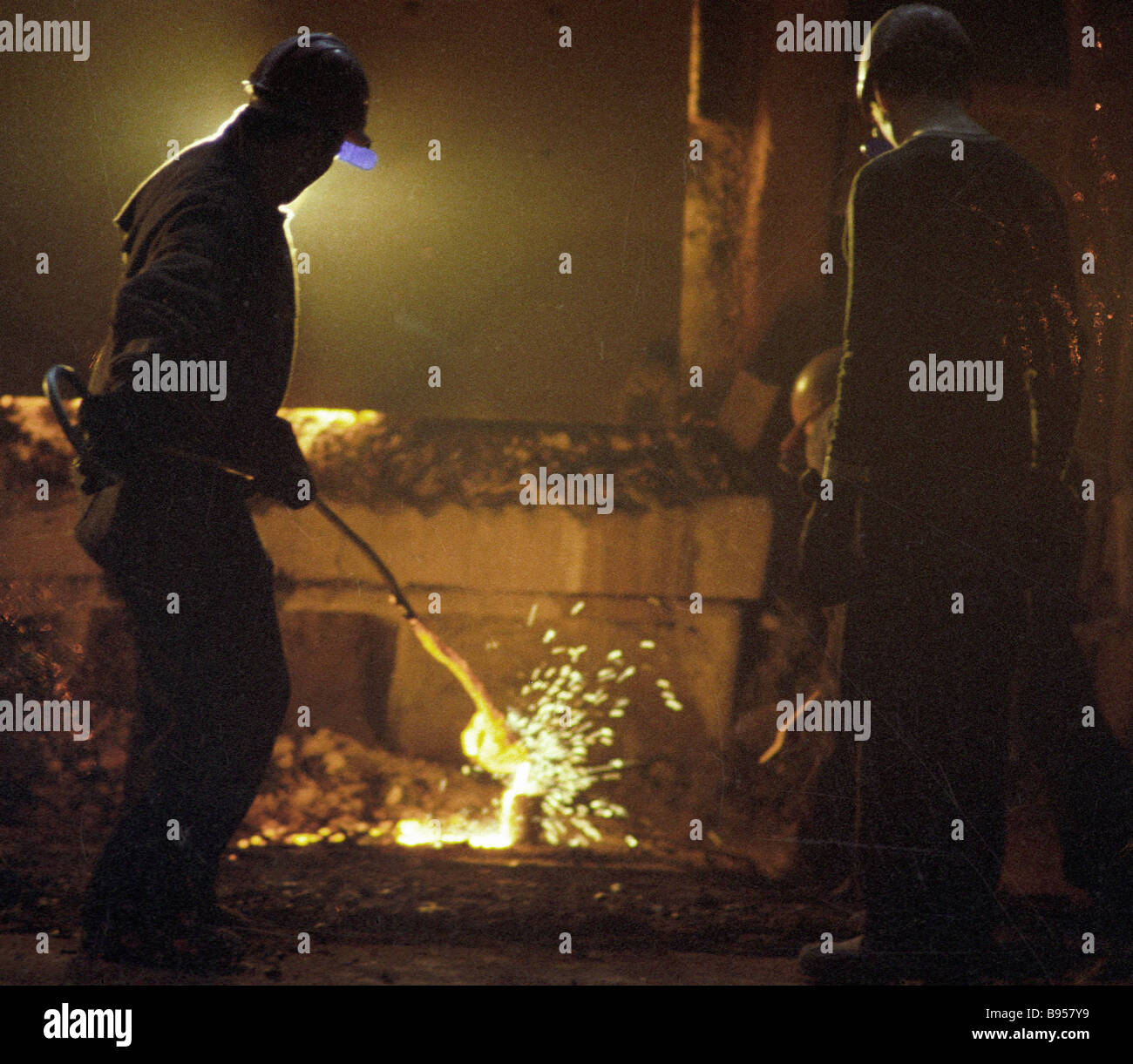 A worker in a Cherepovets Iron and Steel Works shop Stock Photo - Alamy
