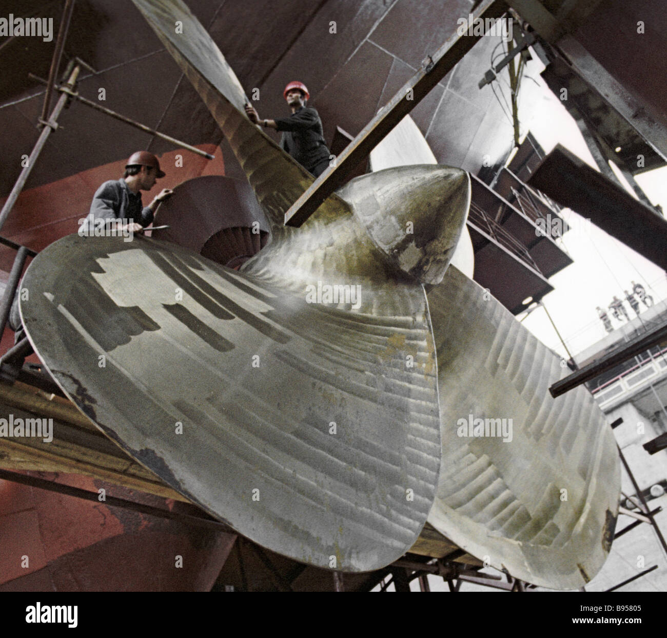 An Okean shipyard foreman examines the Ion Soltys ore freighter ...