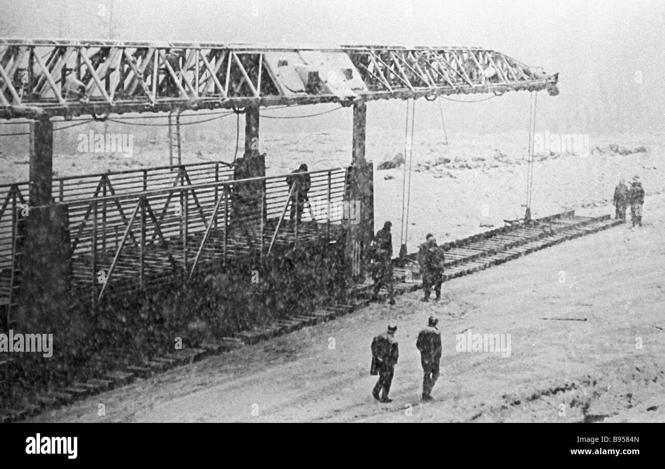 Workers laying a railroad track during the construction of the Baikal ...