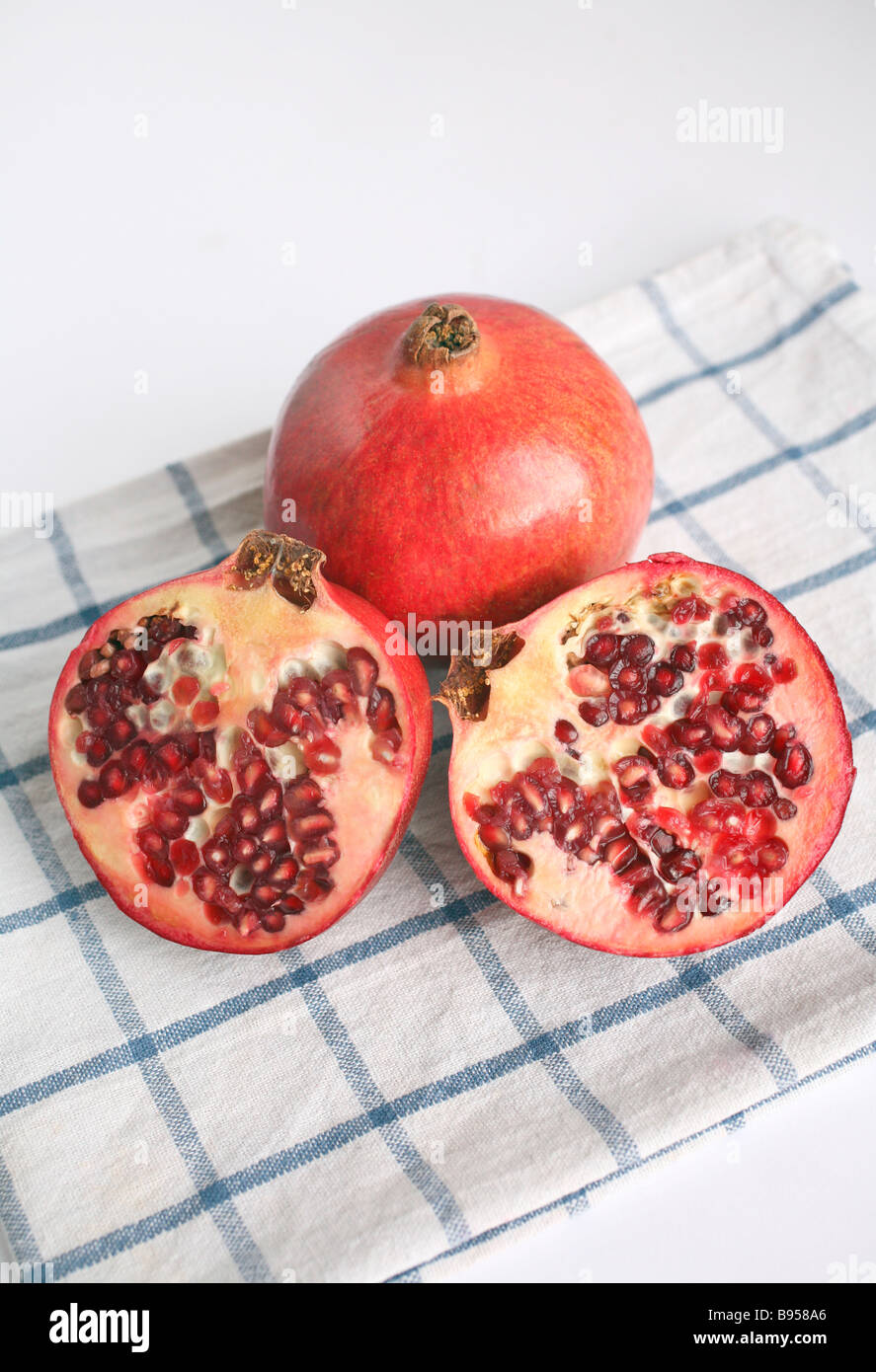 Pomegranate cut in half hi-res stock photography and images - Alamy