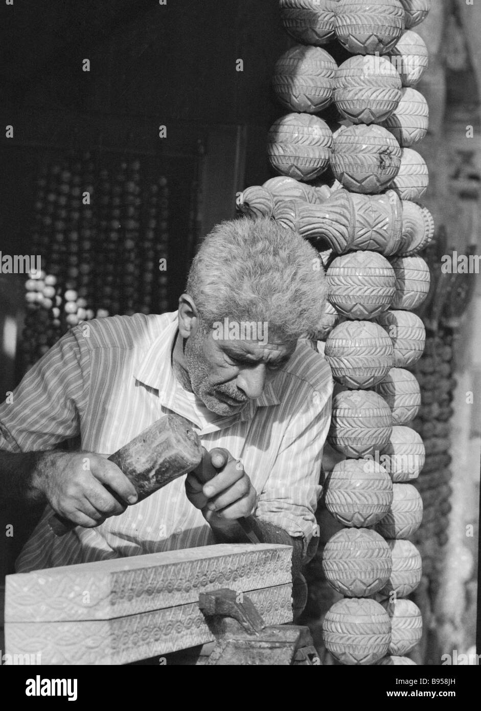 A wood carver at work Stock Photo - Alamy
