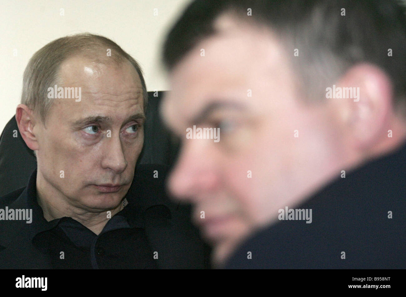 Russian President Vladimir Putin left and Defense Minister Anatoly ...