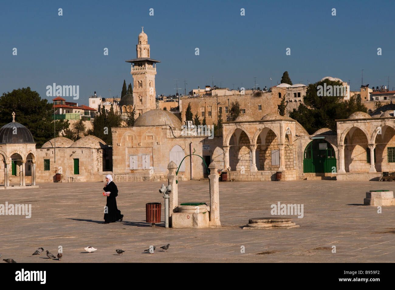 A Palestinian woman walks at the platform of Dome of the Rock in the ...