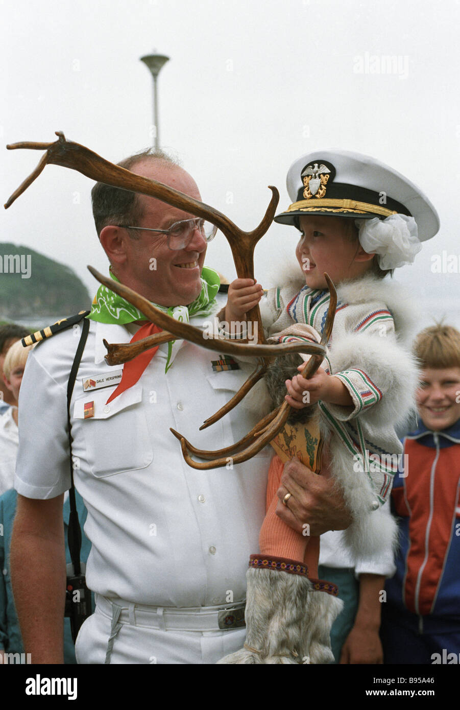 Captain 2nd Rank Dale Hapsing with a Yakut child Stock Photo - Alamy