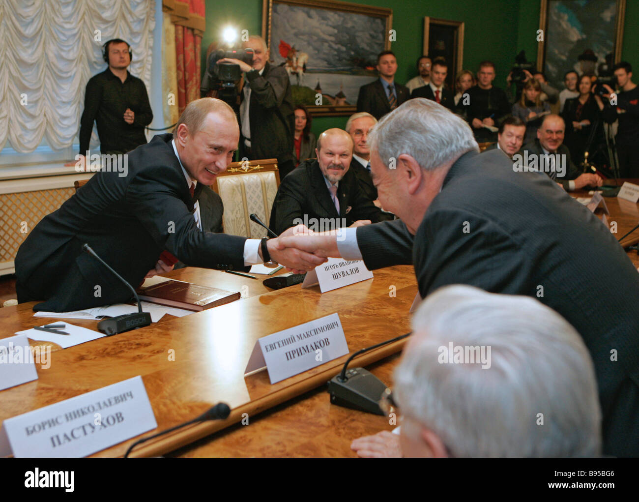 President Vladimir Putin shaking hands with Yevgeny Primakov the head ...