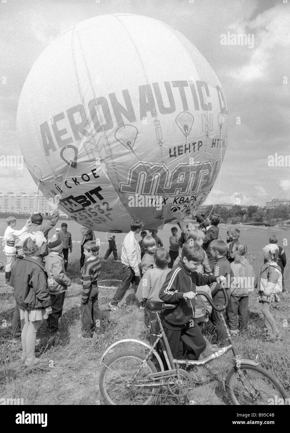 Children preparing an aerostat for flight Stock Photo - Alamy