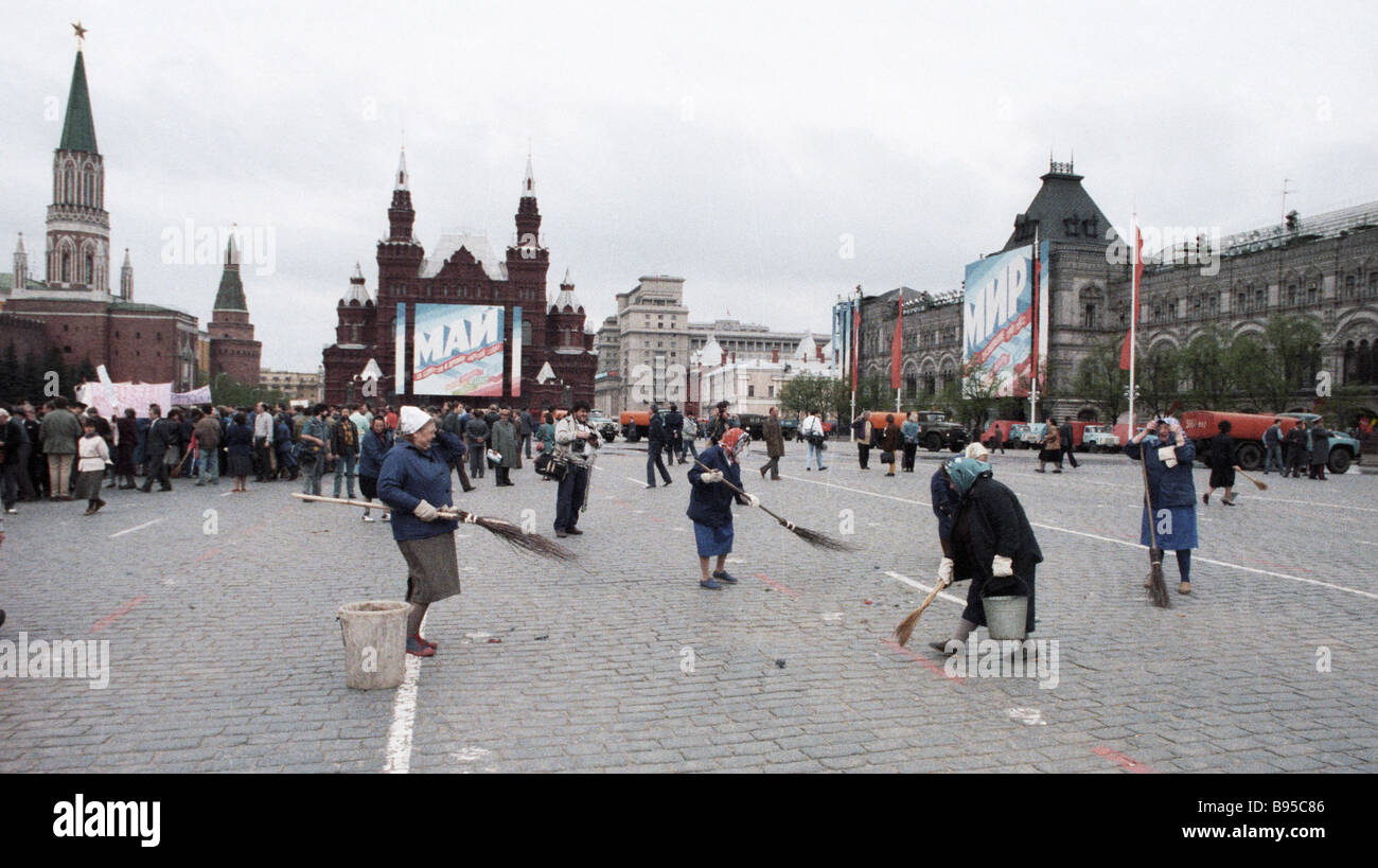 Street cleaners sweeping Red Square after the May Day demonstration ...