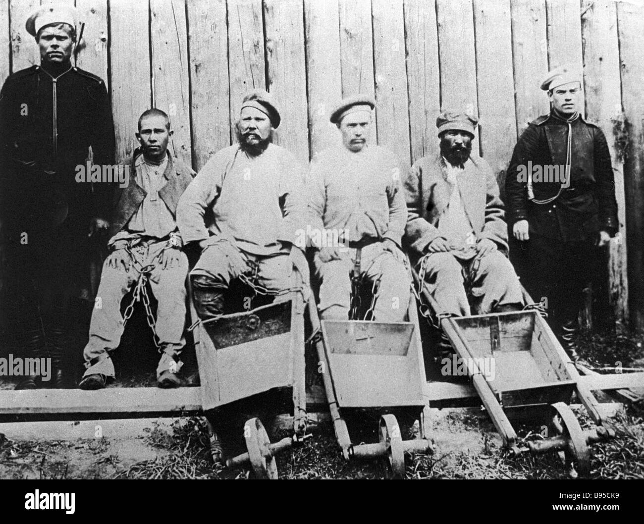 Sakhalin convicts chained to wheelbarrows Stock Photo - Alamy