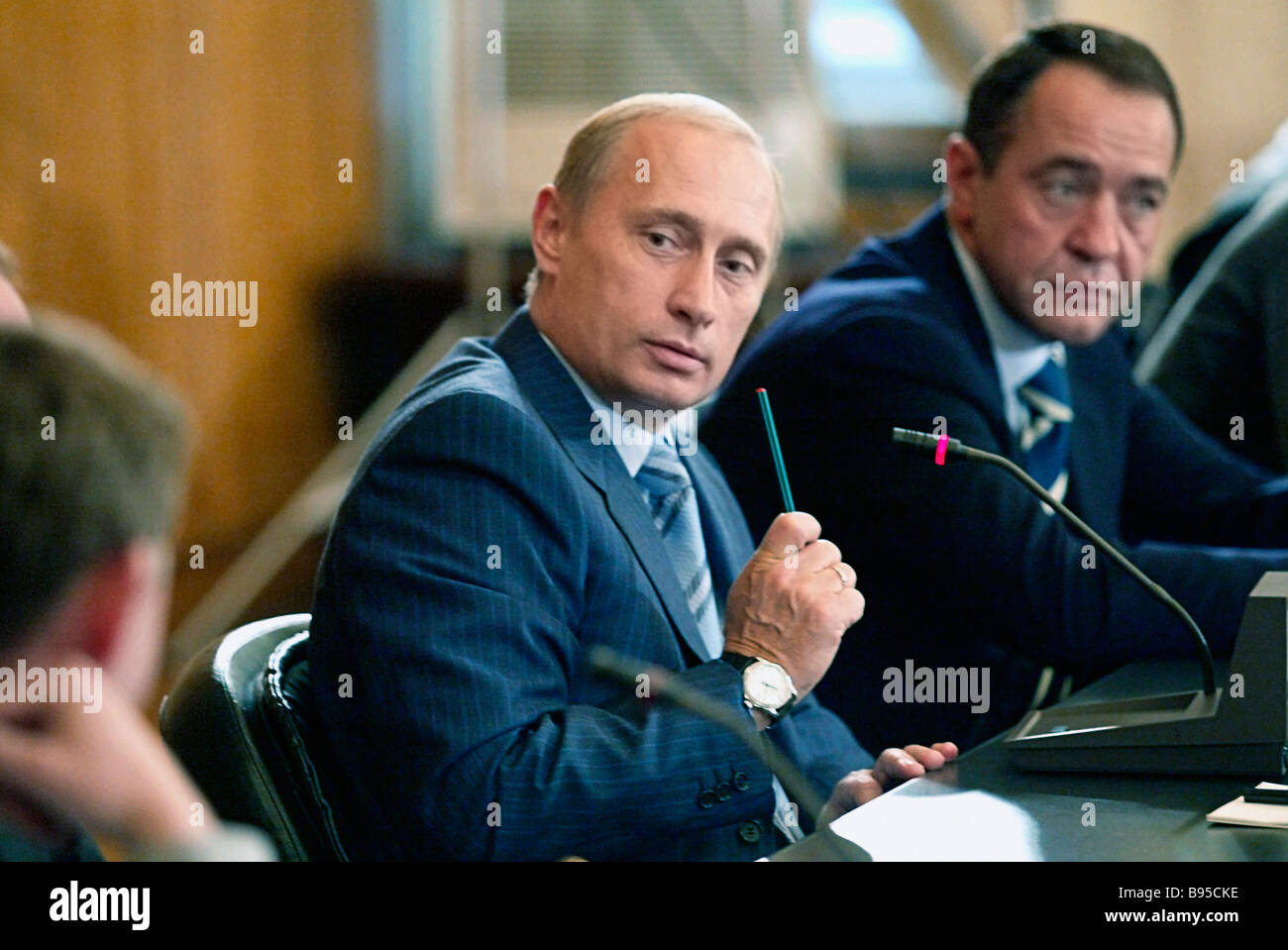 Russian President Vladimir Putin, left, and Press Minister Mikhail ...