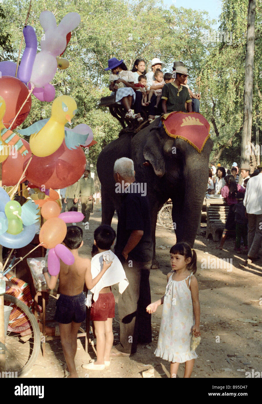 Children riding an elephant Phnom Penh Stock Photo - Alamy