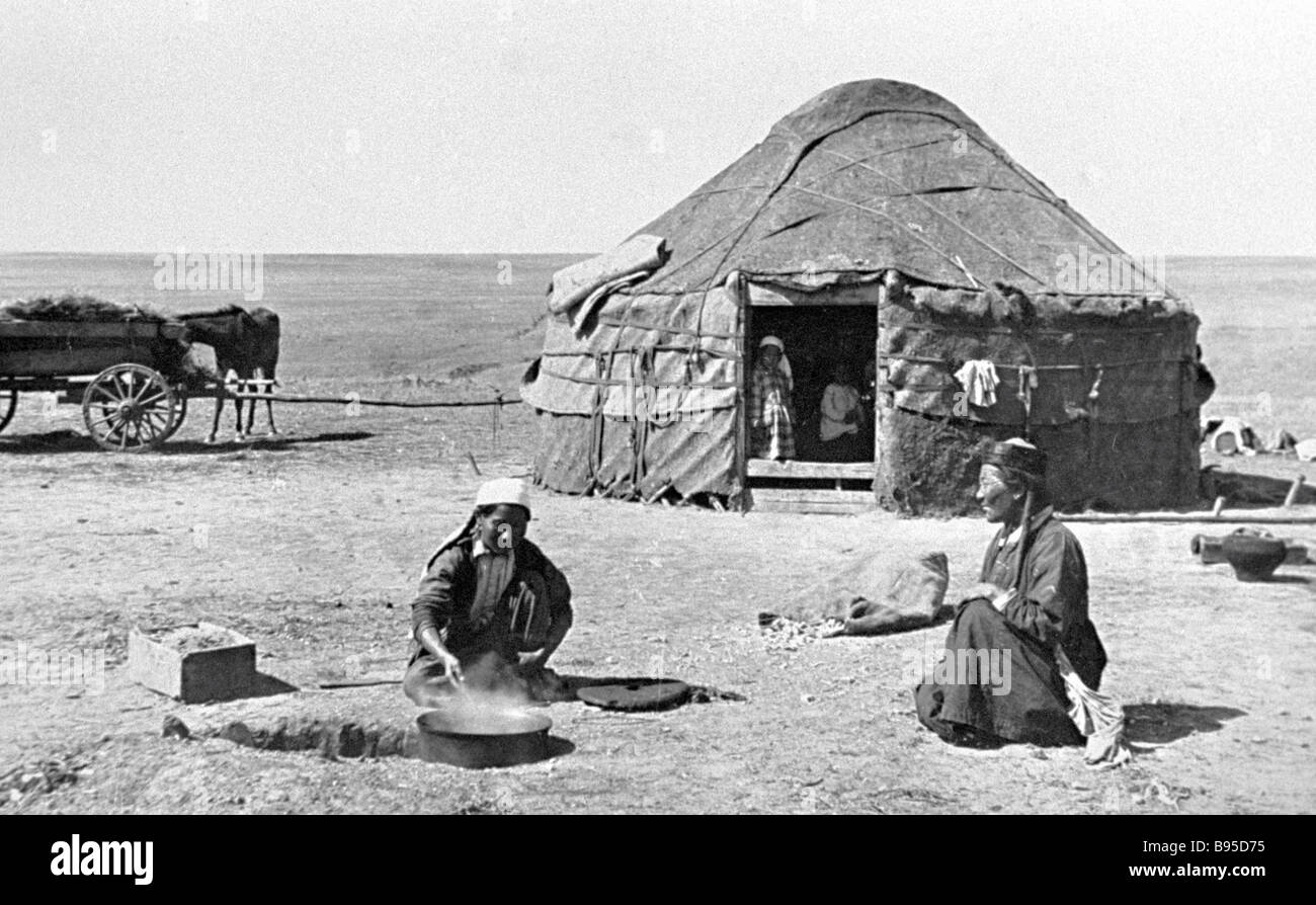 Kalmyk women cooking a meal in front of a jurt nomad s tent Stock Photo ...