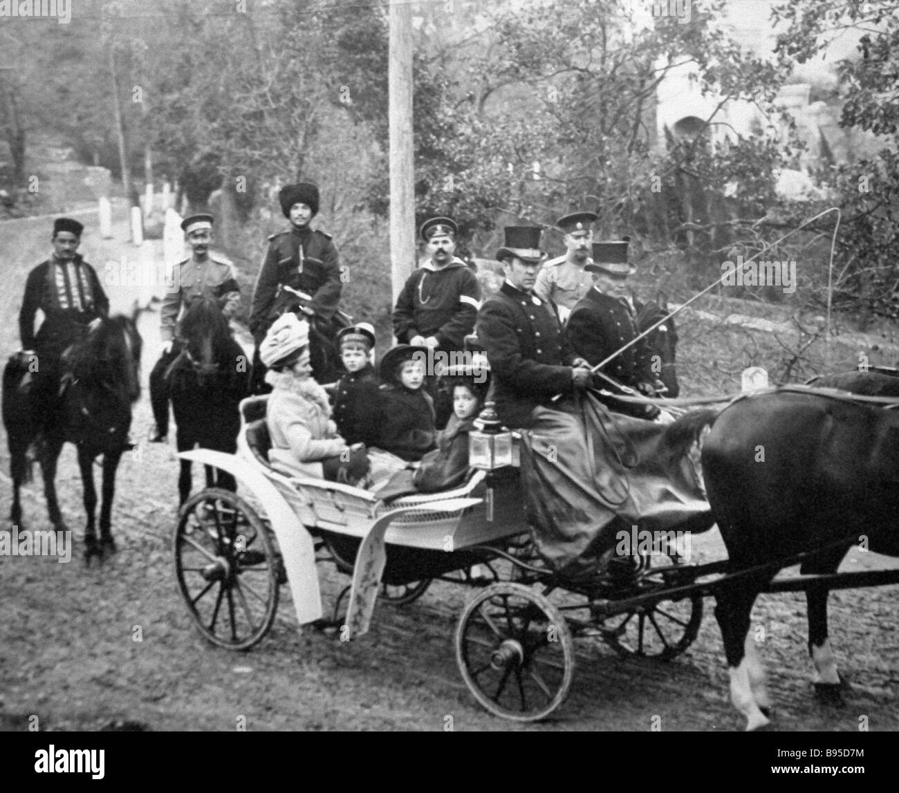 Tsarevich Alexei and his sisters sitting in a carriage during a ride ...