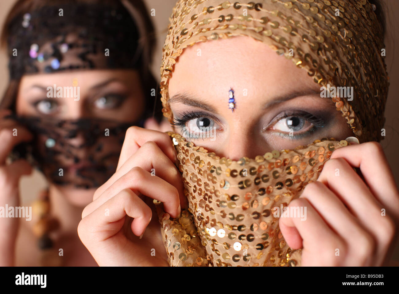 Two girls wearing head scarf's showing eyes Stock Photo - Alamy