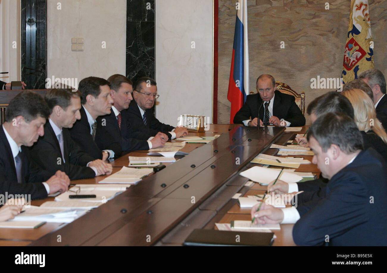 Russian President Vladimir Putin center at a meeting with cabinet ...