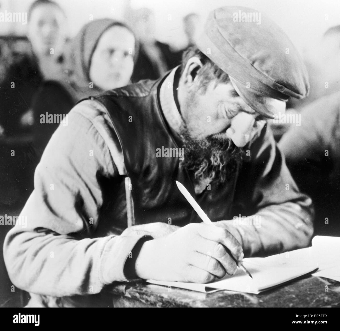 A peasant attending literacy classes Stock Photo - Alamy