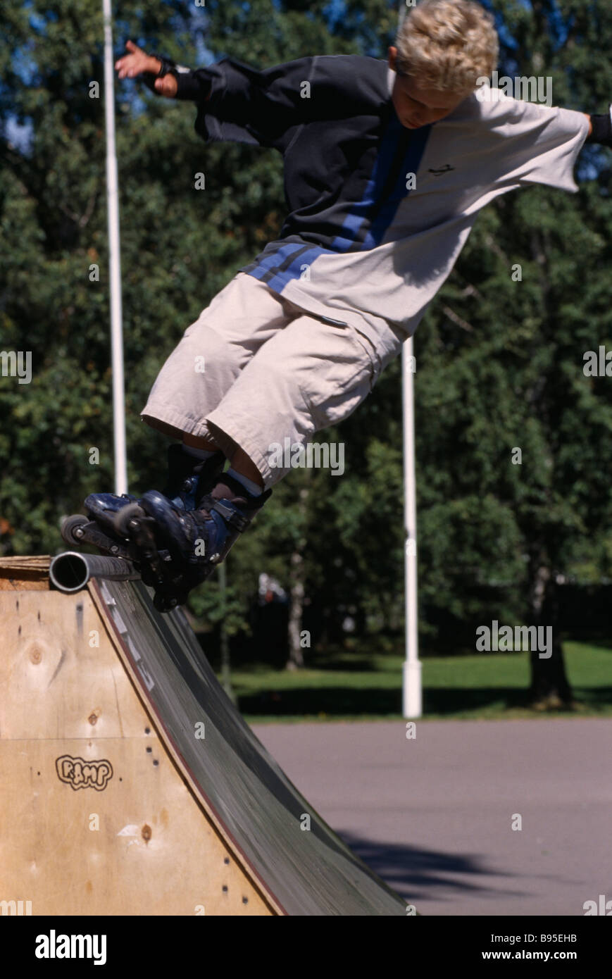 SPORT Rollerskating In Line Skating Boy on ramp Stock Photo - Alamy