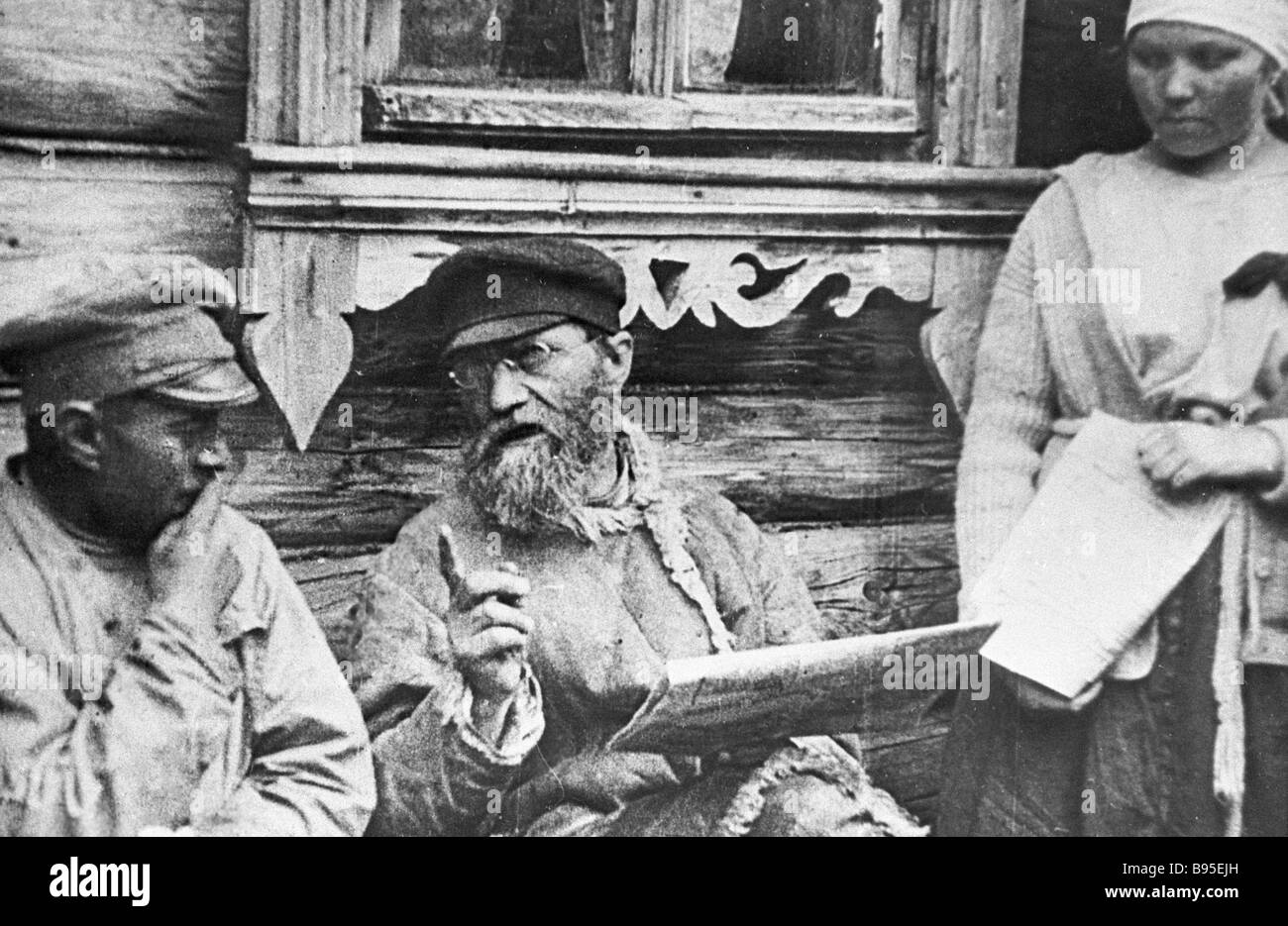 Peasants reading a newspaper which published Lenin s decrees on land ...