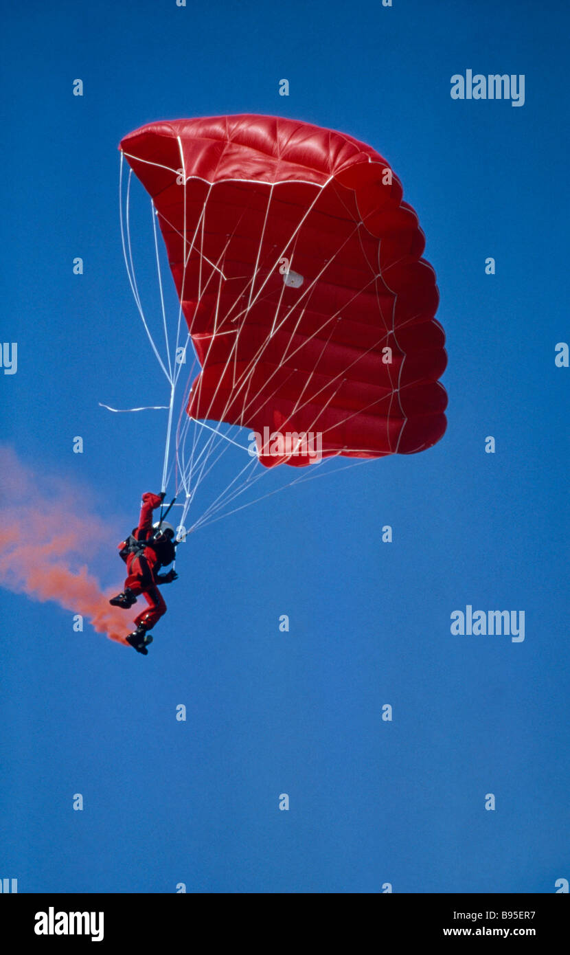 Parachutist with red garments hi-res stock photography and images - Alamy