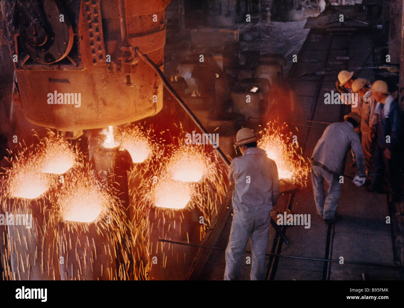 CHINA Liaoning Anshan Interior of steel works with male workers Stock ...