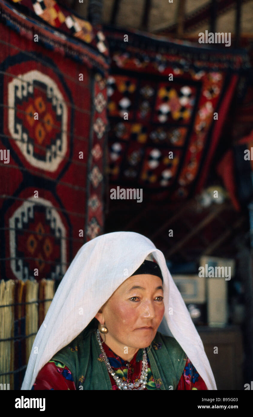 AFGHANISTAN People Kirghiz woman sat in yurt wearing traditional dress ...