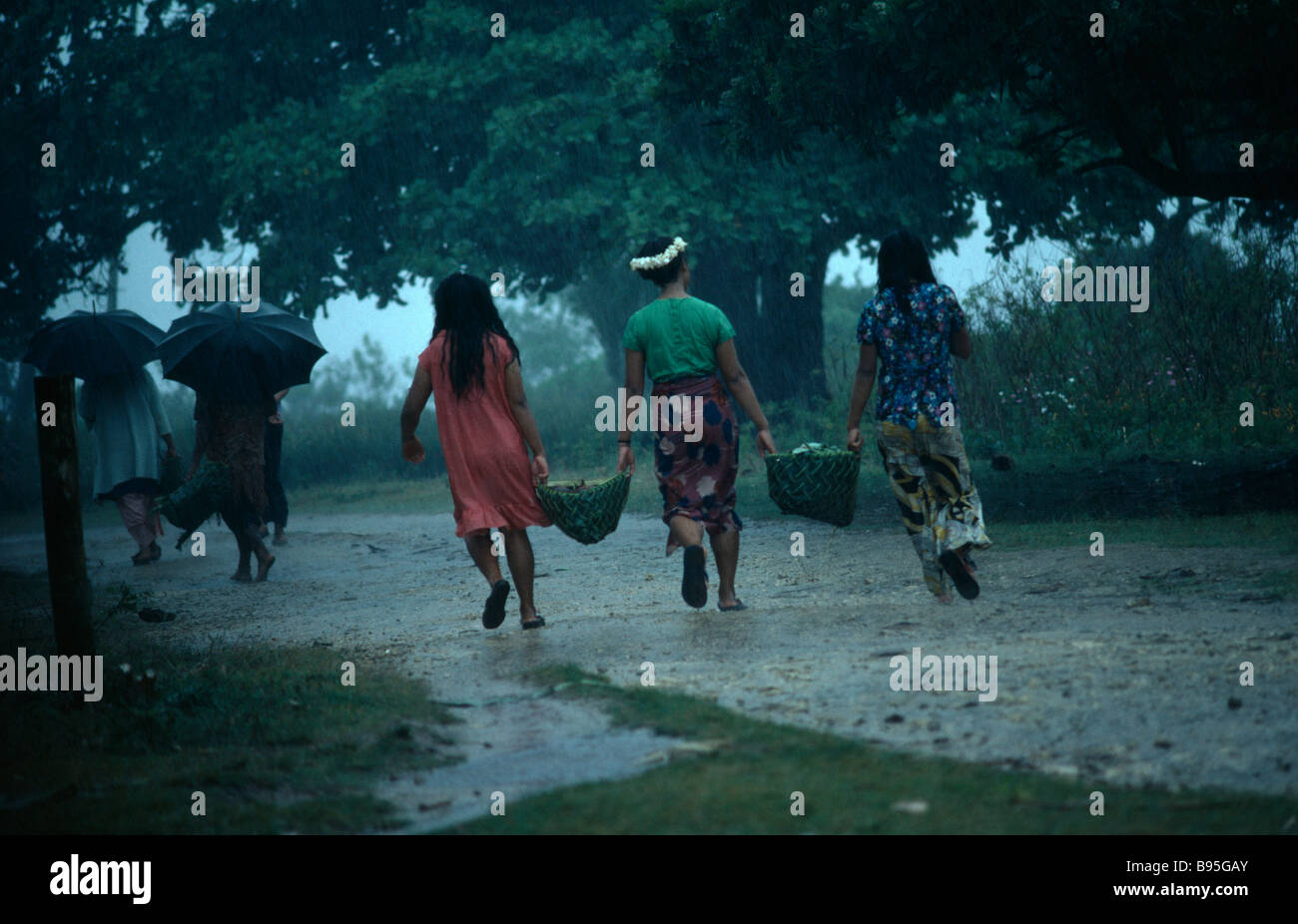 PACIFIC ISLANDS Polynesia Tonga Tongan women carrying woven baskets ...
