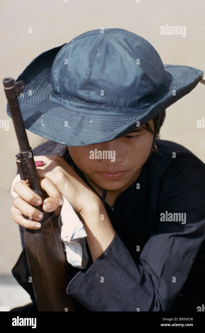 VIETNAM War South Mekong Delta Civil Defence girl soldier leaning on ...