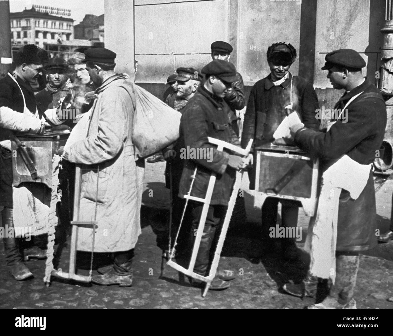 Seasonal workers buy pies in the street Stock Photo - Alamy
