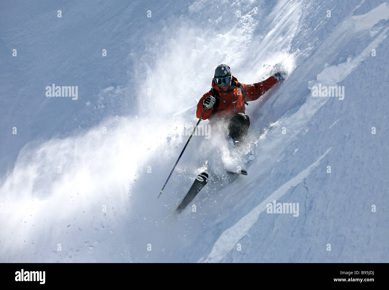 Skier at speed on a very steep slope in fresh snow Stock Photo - Alamy