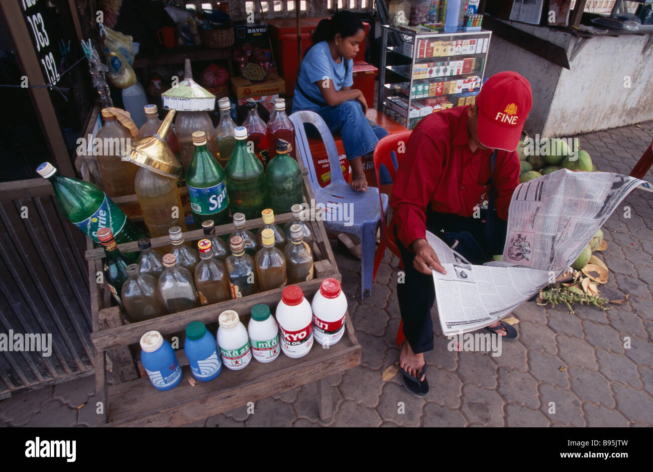 CAMBODIA Siem Reap Roadside stall selling bottle petrol watered down at ...