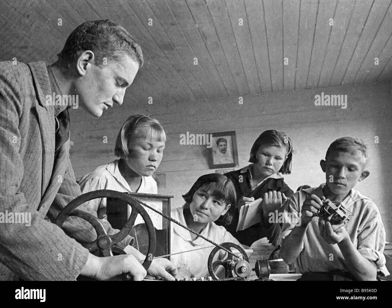 A young teacher demonstrating a physics experiment Novaya Uda ...