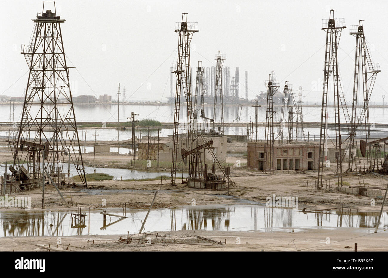Old and new oil rigs on the Caspian Sea Stock Photo - Alamy