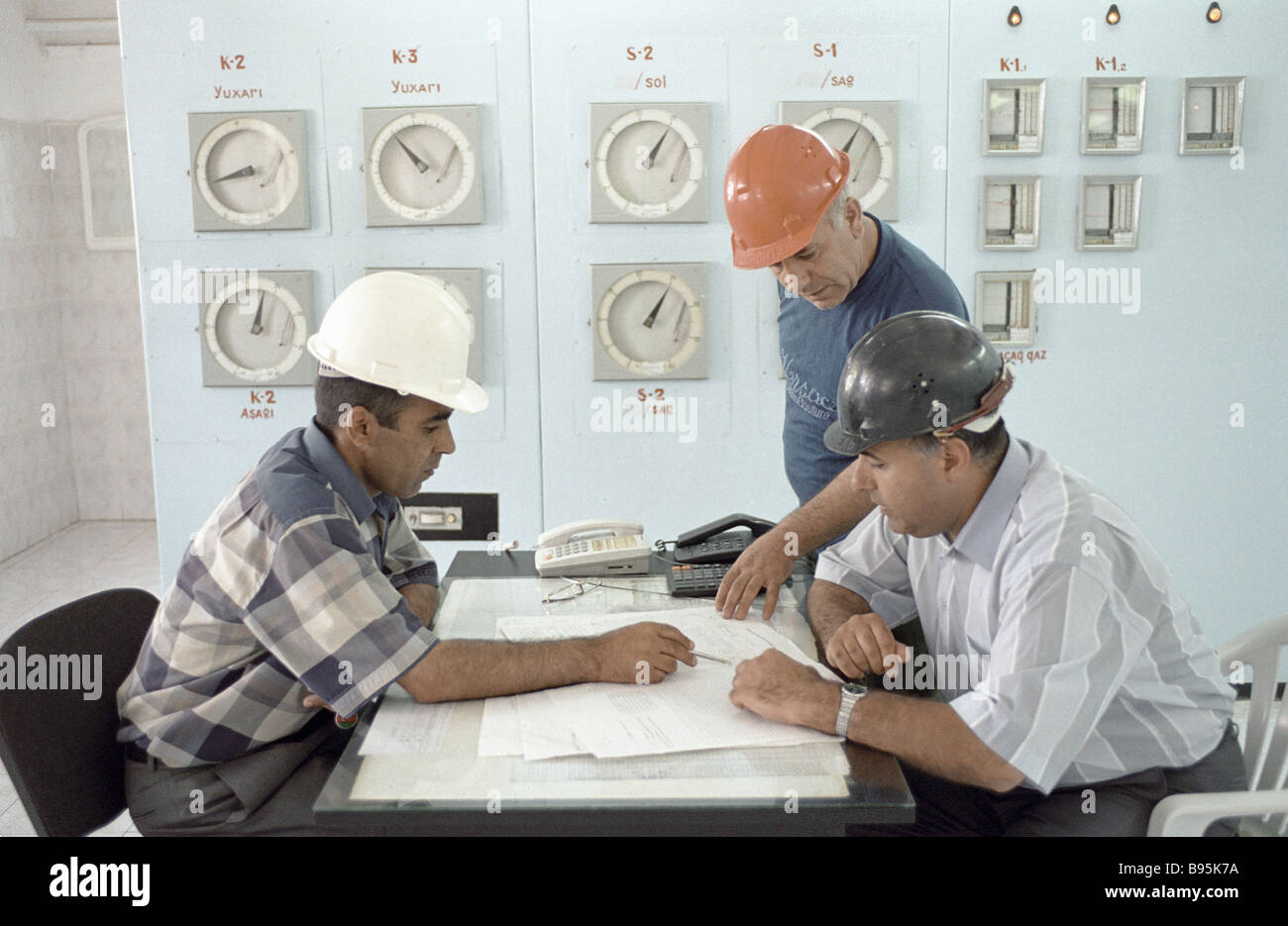 Workers of the Baku Oil Refinery in the control room Stock Photo - Alamy
