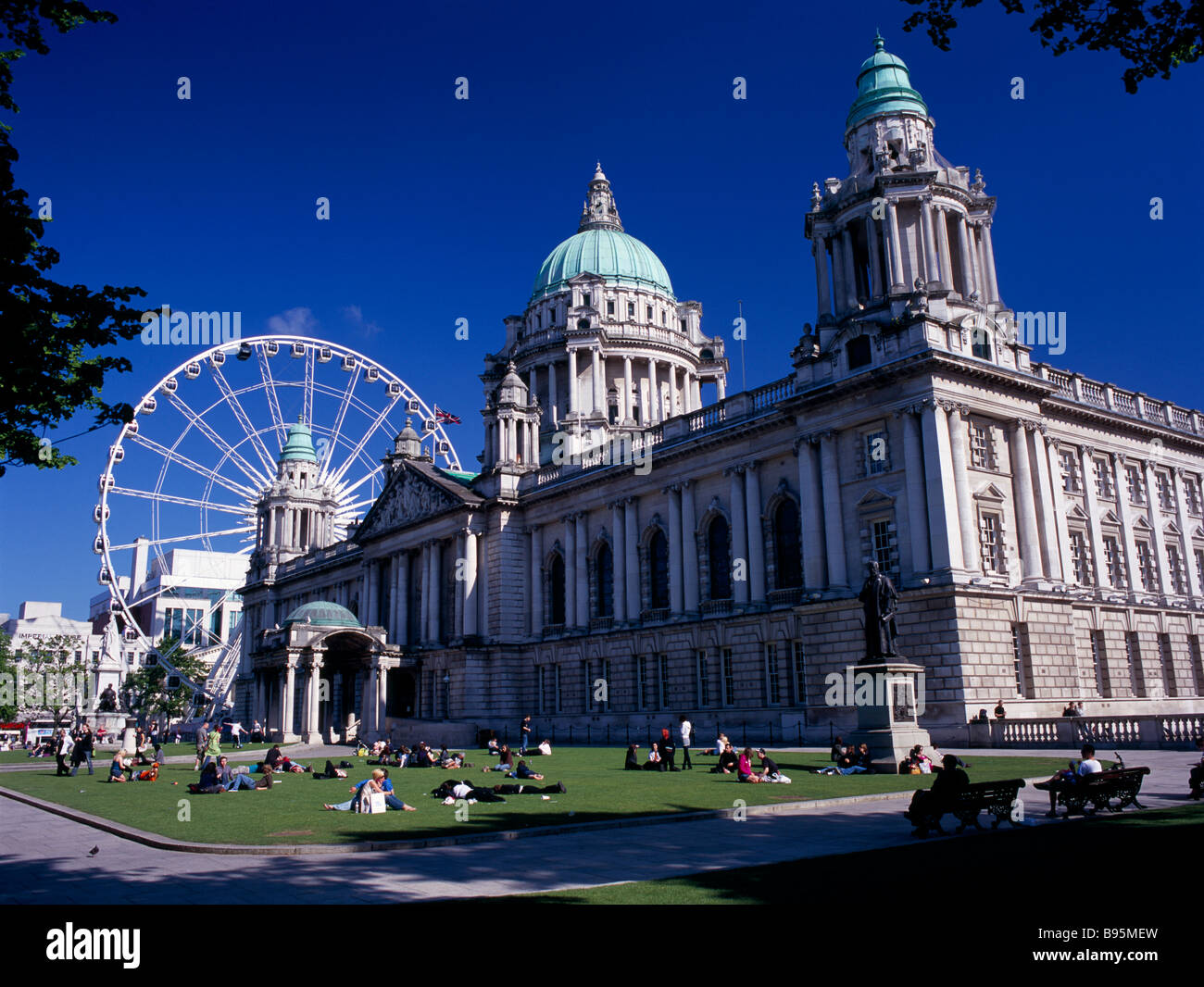 Northern Ireland, Belfast. People sitting or lying in the sun in the ...