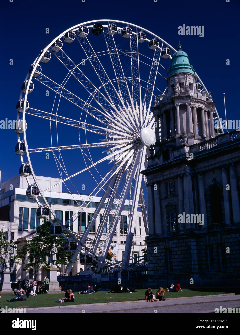 Northern Ireland, Belfast. City Hall and the Wheel of Belfast with ...