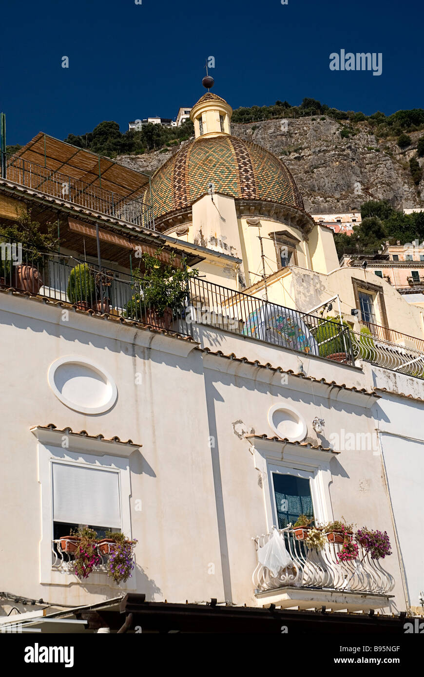 Italy, Campania, Salerno, Positano. Street with majolica dome of Church ...