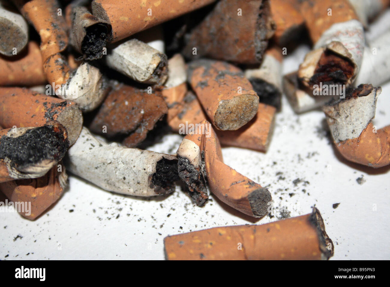 A pile of used cigarettes Stock Photo - Alamy