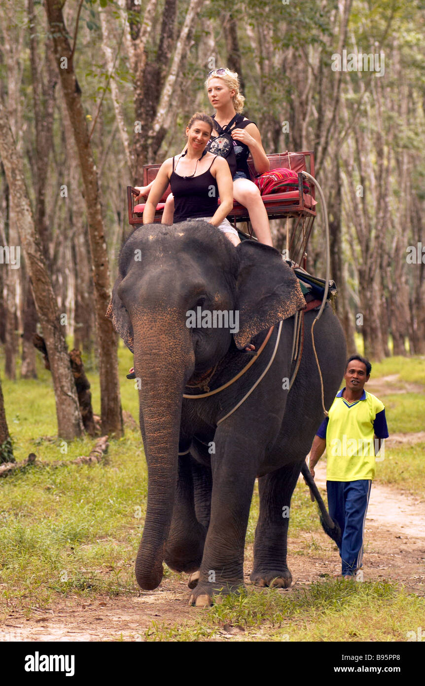 Women ride elephant Stock Photo - Alamy
