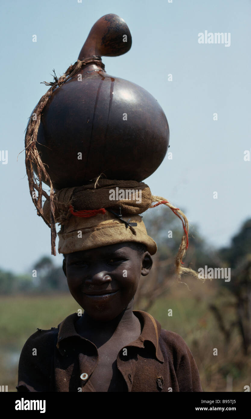 BURUNDI Central East Africa Children Portrait of Hutu child carrying ...