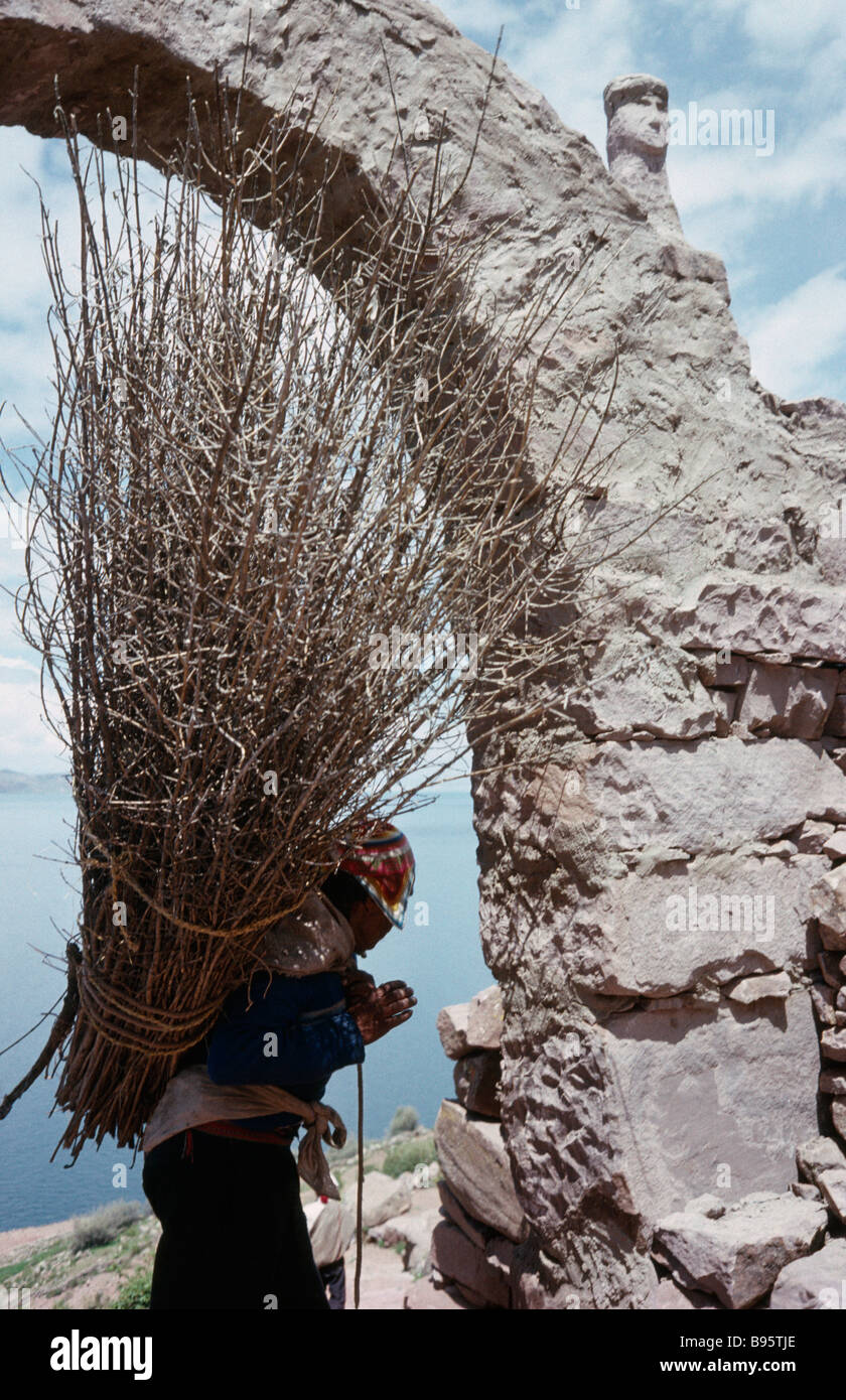 Carrying bundle on back hi-res stock photography and images - Alamy