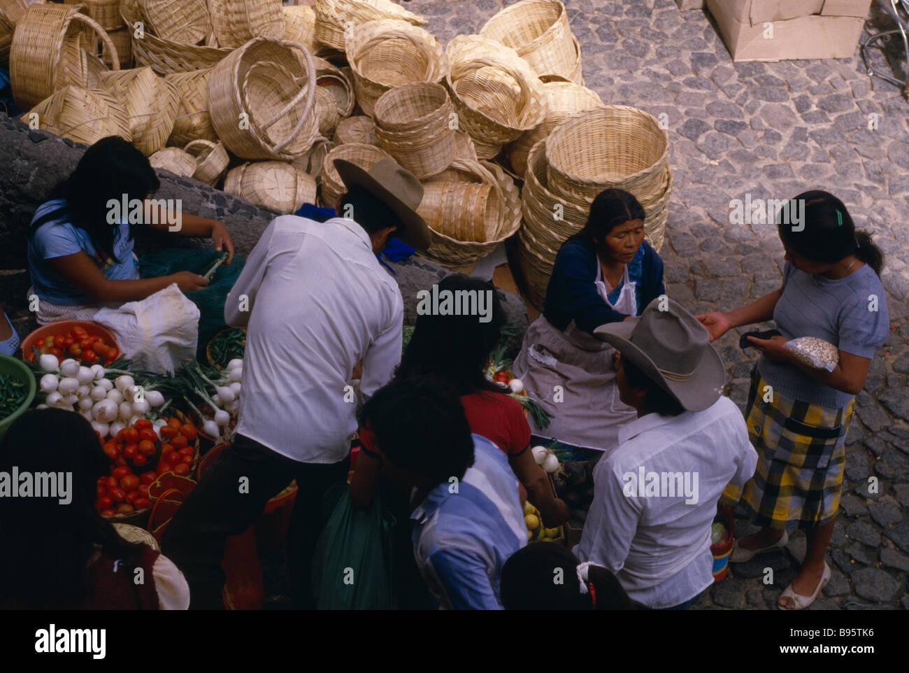 MEXICO Taxco Looking down on customers at fruit and vegetable stall in ...